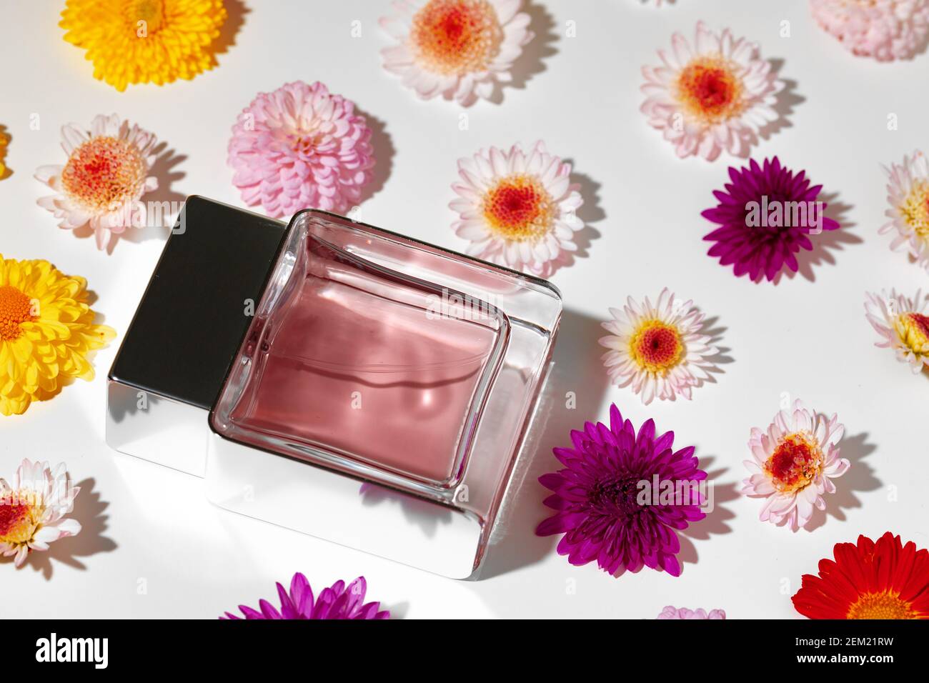 Perfume bottle for women in flower buds Stock Photo - Alamy