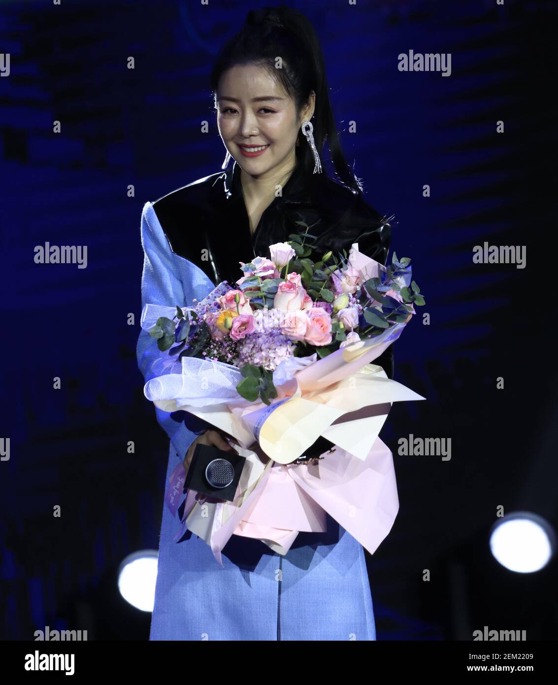Chinese singer Angela An Youqi sings a song at Yichang Theatre in ...