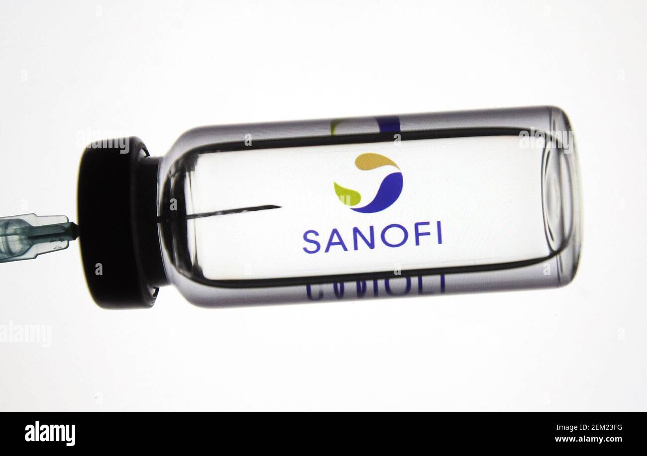 In this photo illustration a medical syringe and a vial with fake ...