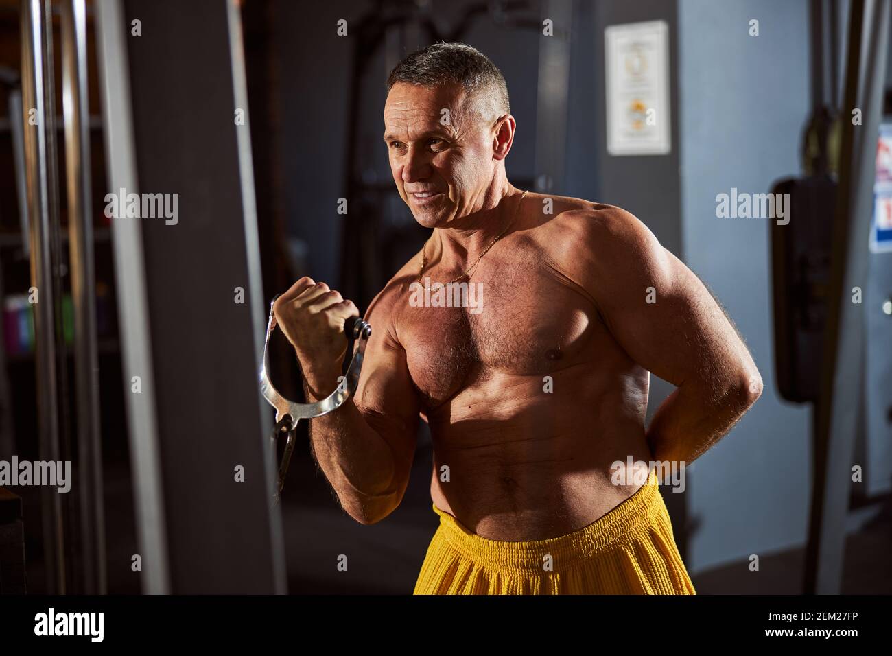 Enthusiastic male athlete working out at his regular gym Stock Photo ...