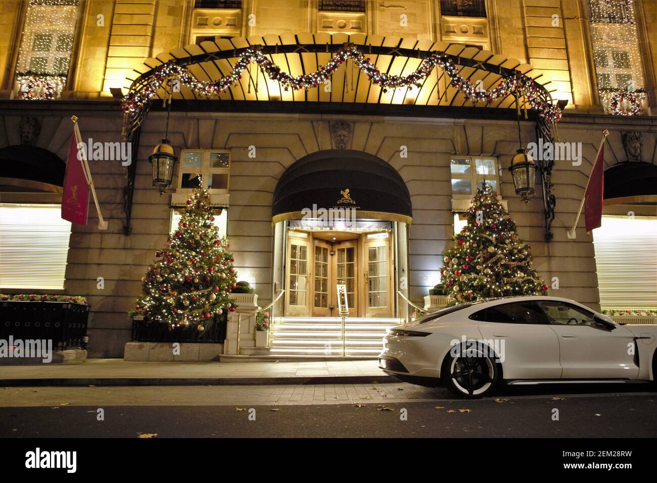 Christmas lights are lit up at the Ritz London. People are getting ...
