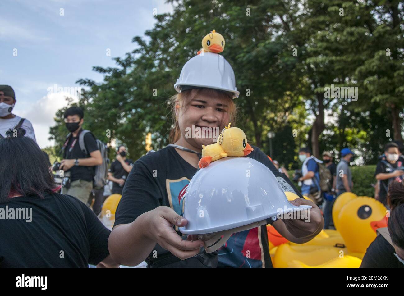 A protester prepares an helmet with Inflatable yellow duck during the ...