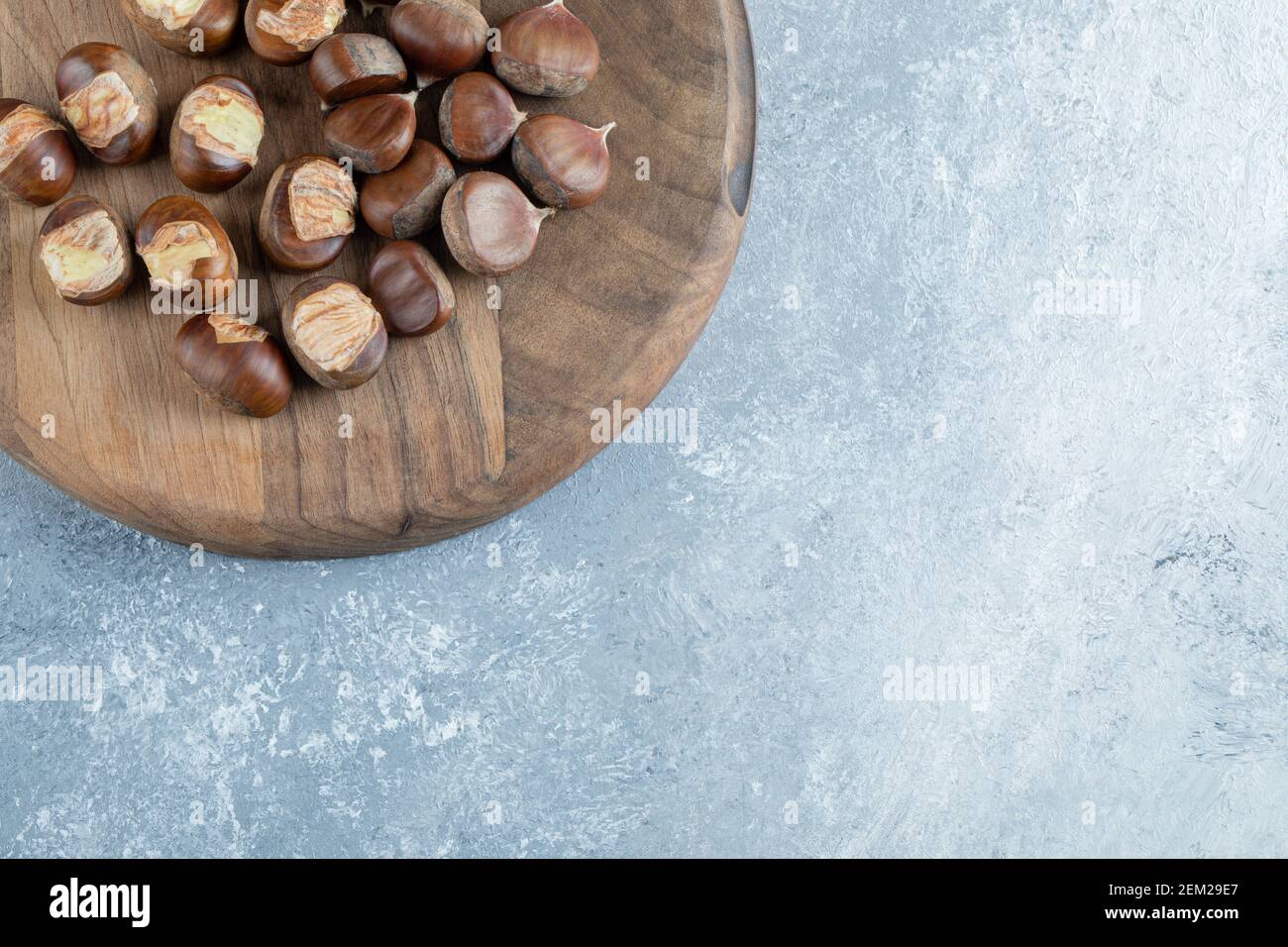 Delicious healthy chestnuts on a tree bark Stock Photo - Alamy