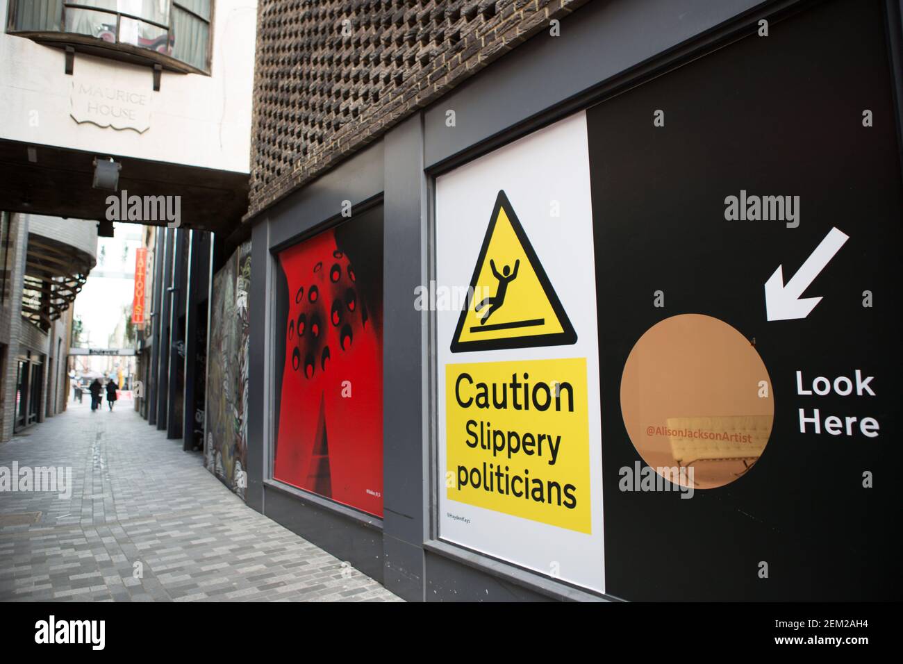 A caution sign seen at Trump and Miss Universe art installation by ...