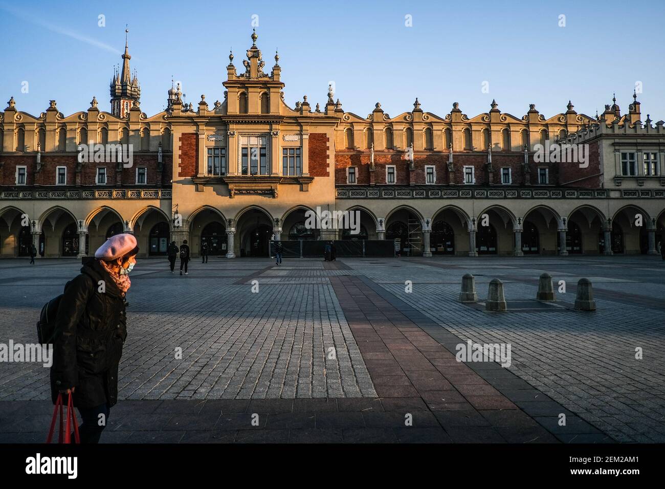 A woman wearing a face mask as a precaution against the spread of covid ...