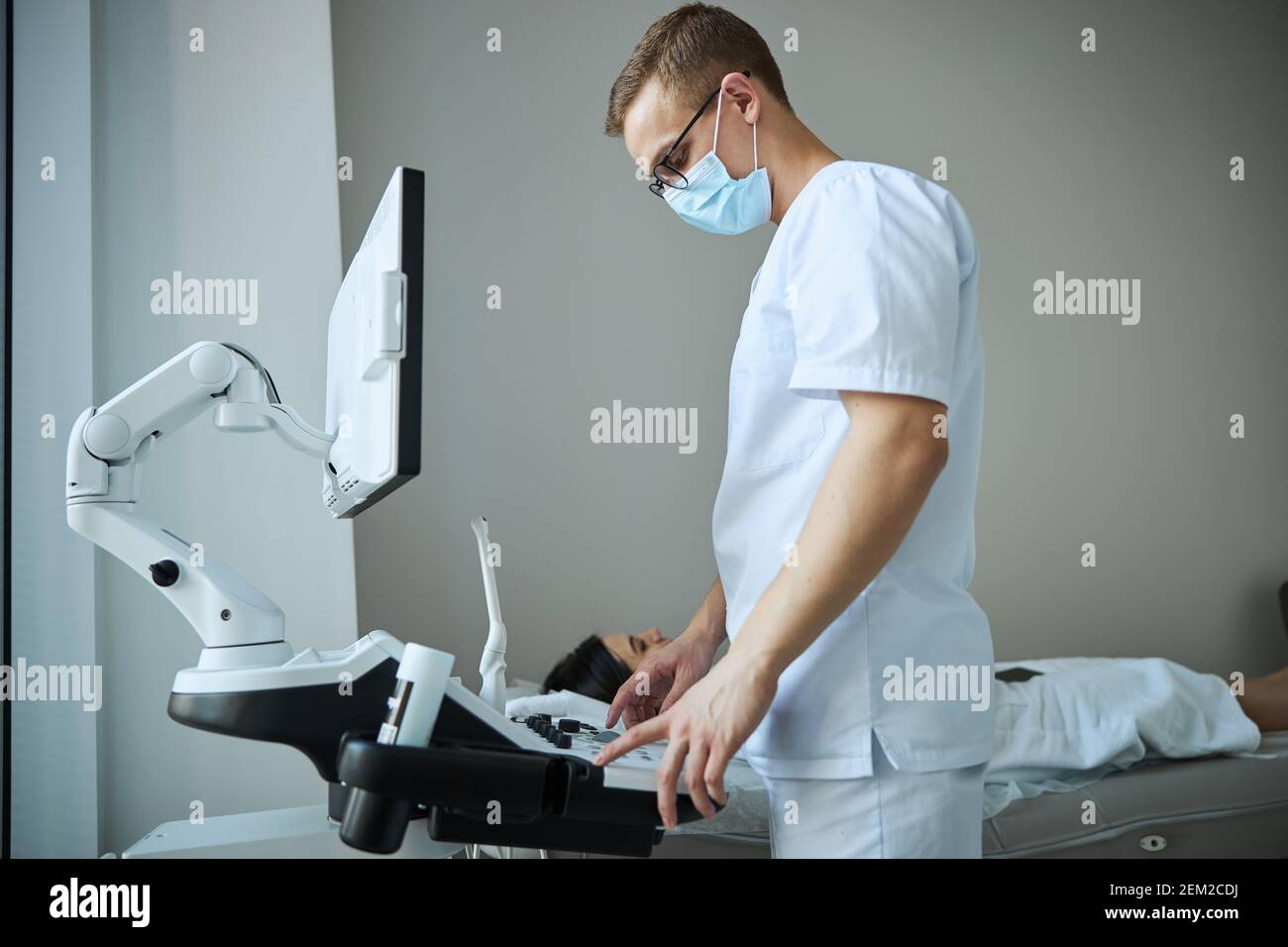 Doctor getting ready to perform a sonography on a patient Stock Photo ...