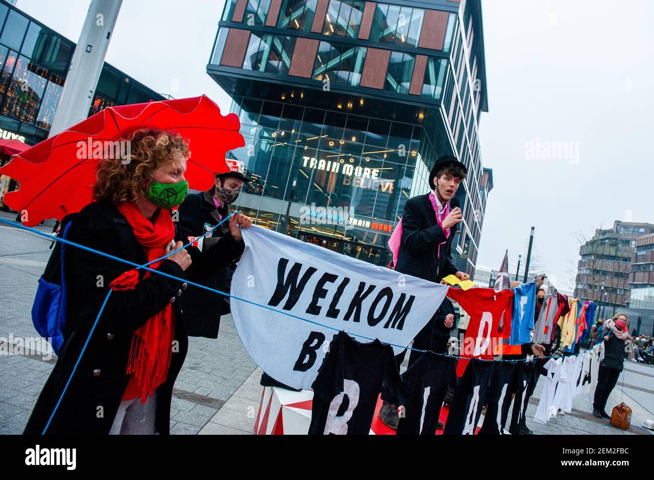 An activist is seen giving a speech in front of the Hoog Catharijne ...