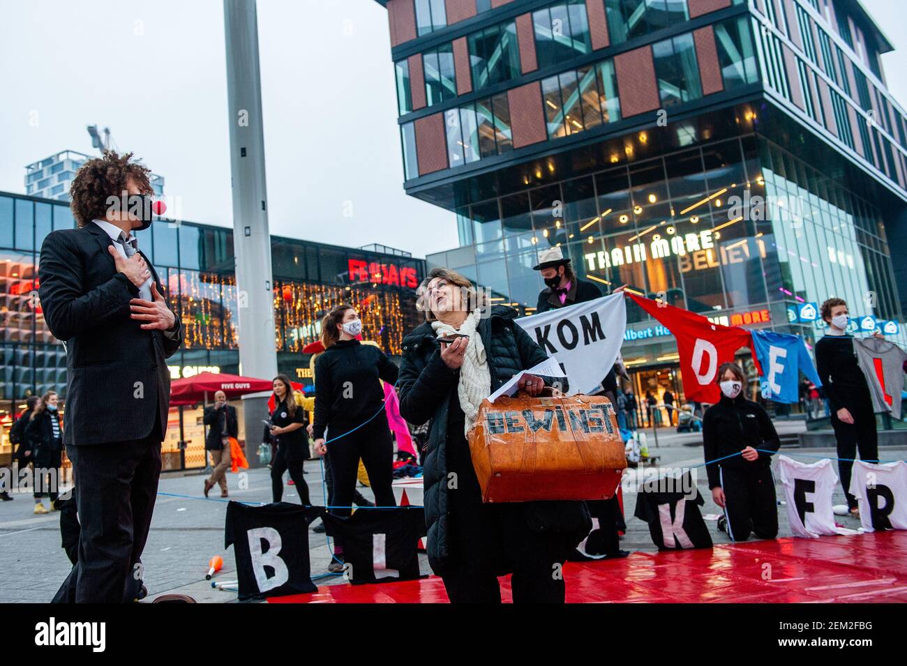 A woman is seen singing during the demonstration. In many cities around ...