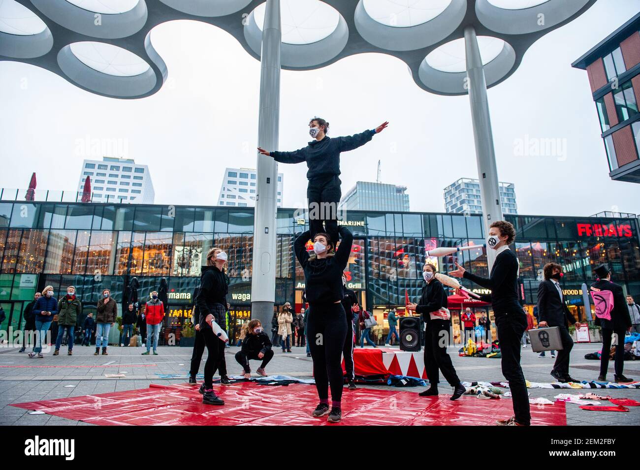 A group of acrobats are seen performing during the circus protest. In ...