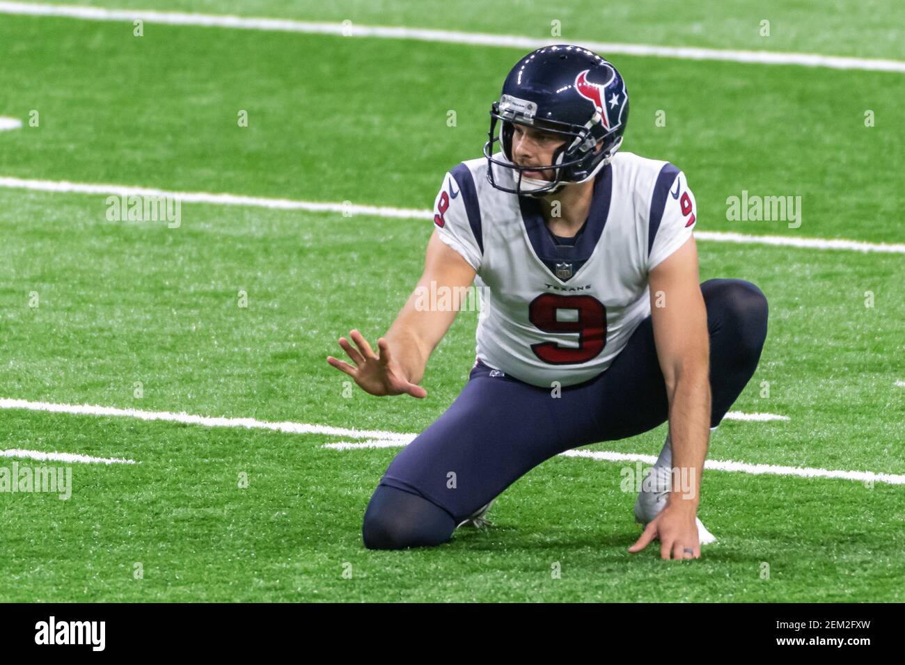 DETROIT, MI - NOVEMBER 26: Houston Texans P Bryan Anger (9), holding ...