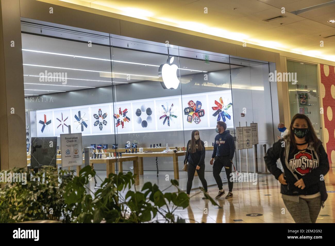 Shoppers walk past an Apple Store at Franklin Park Mall during Black ...