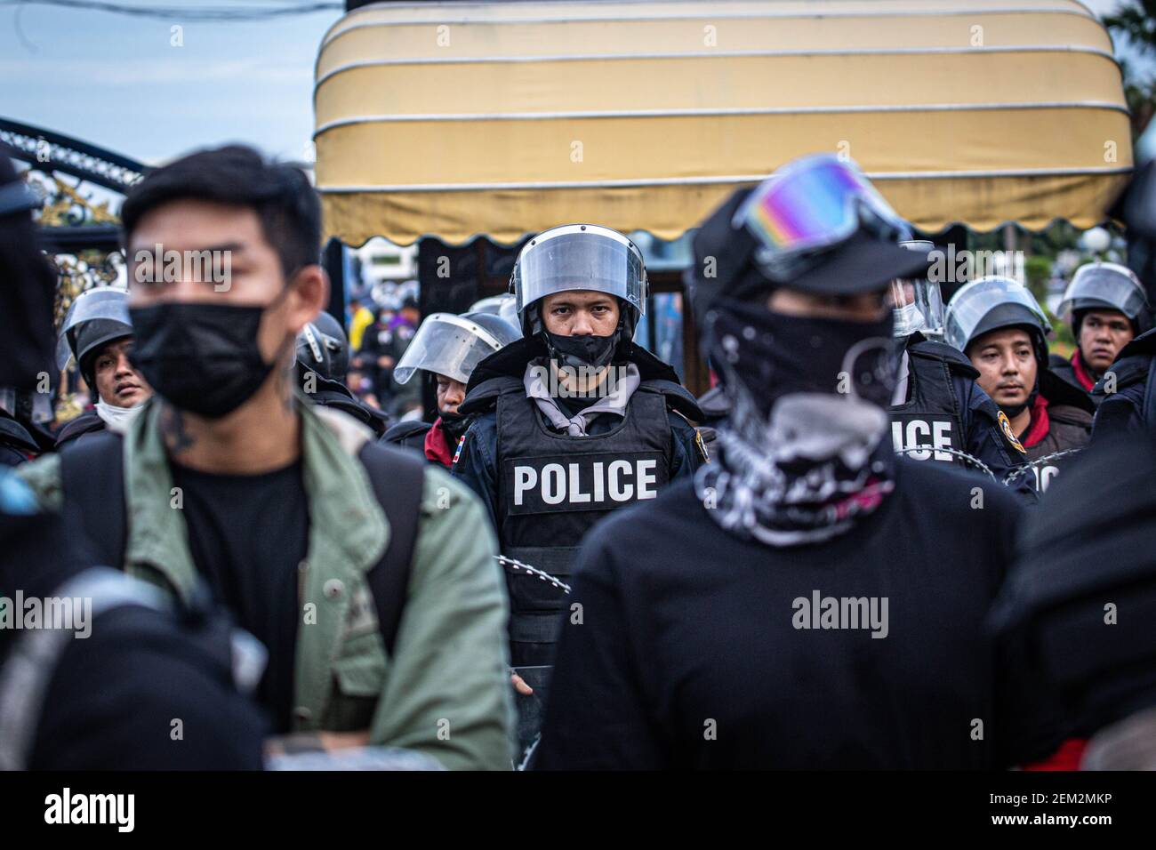 A riot policeman look at the camera during an anti-government ...