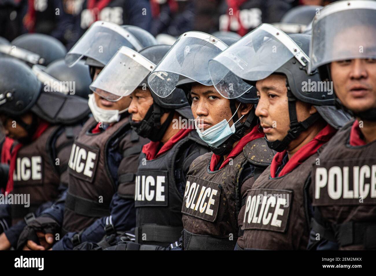 A riot policeman look at the camera during an anti-government ...