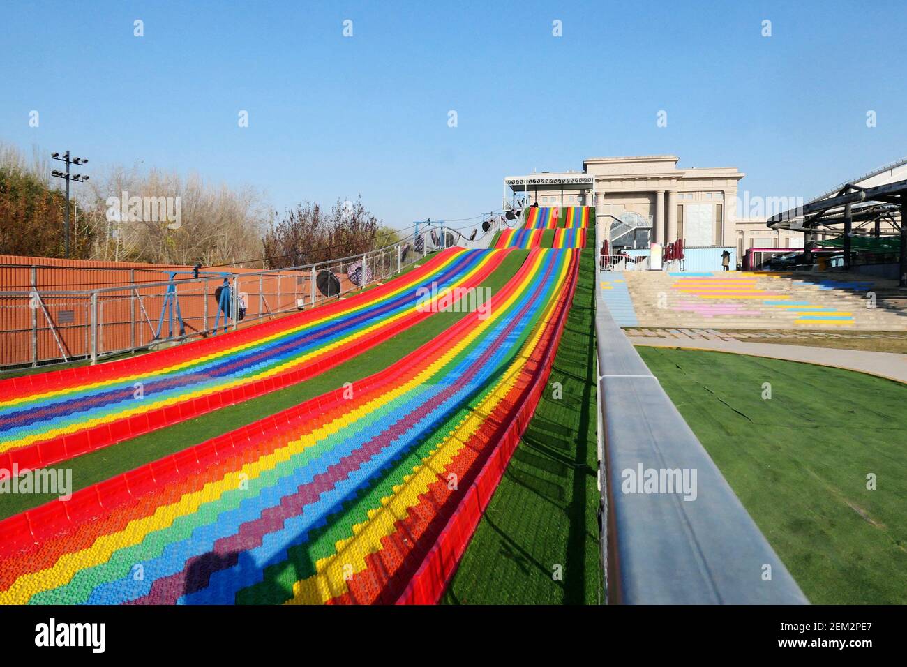 Beijing, CHINA-Tourists play on the colorful slide, Nov. 30, 2020 ...
