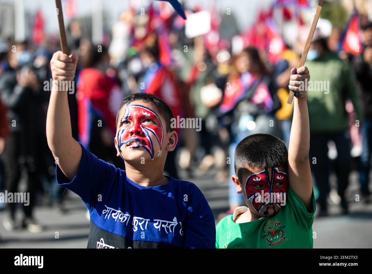 Nepalese boys with national flags painted on their faces seen during a ...
