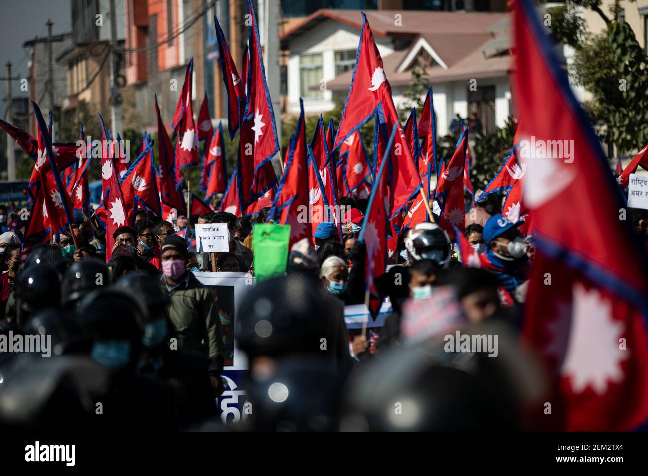 Hundreds of Nepalese people with national flag seen during a pro ...