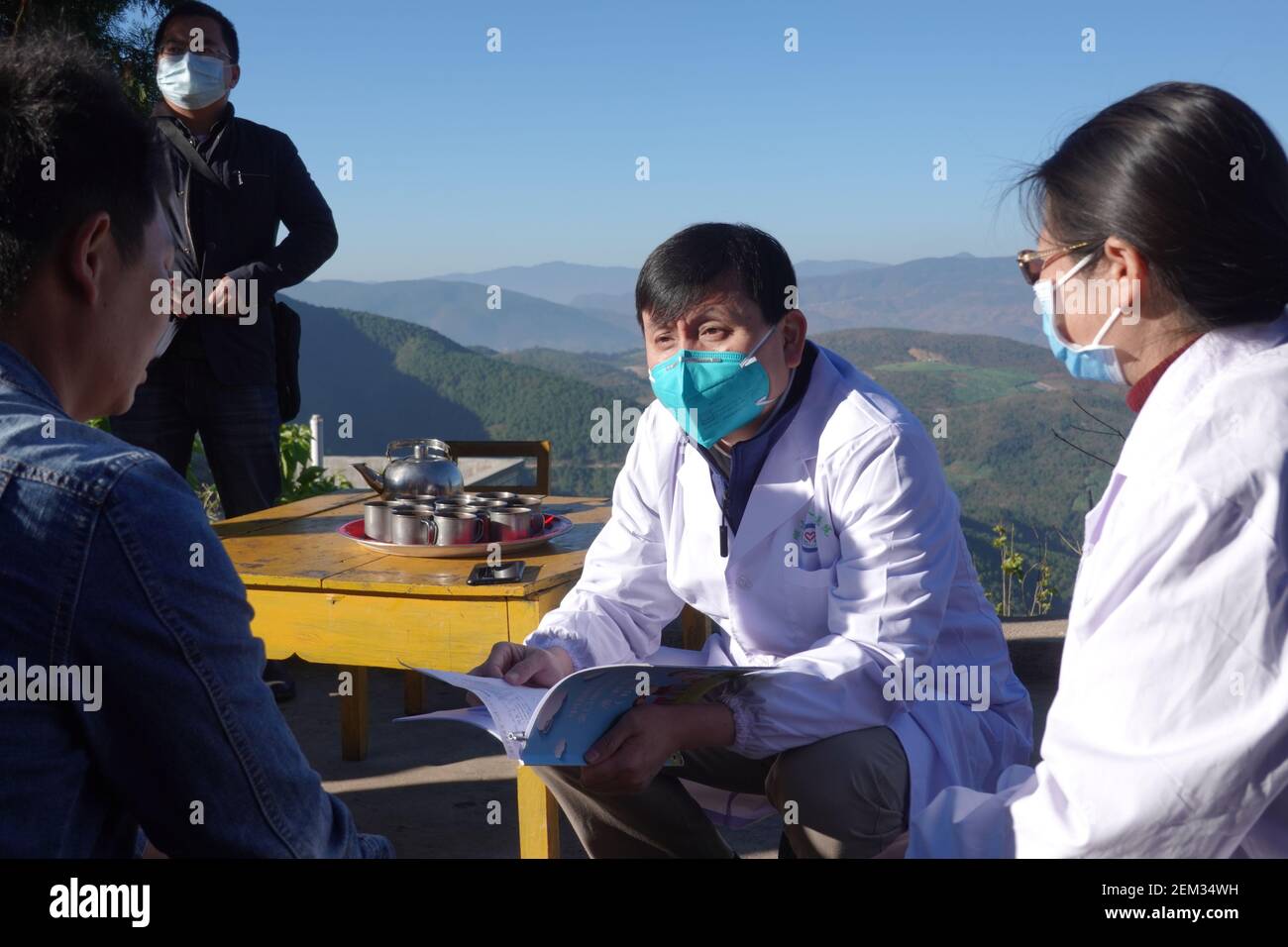 Chinese doctor Zhang Wenhong, middle, and staff from AliHealth owned by ...
