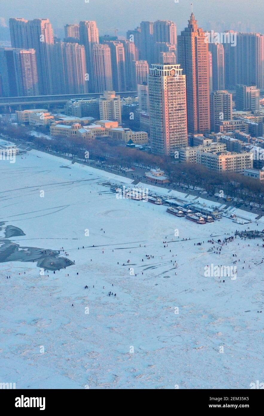 --FILE--An aerial view of the frozen Songhua River covered by snow ...