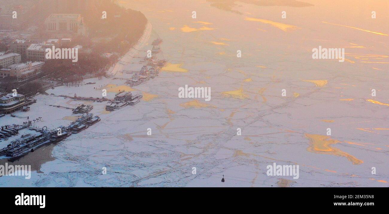 --FILE--An aerial view of the frozen Songhua River covered by snow ...