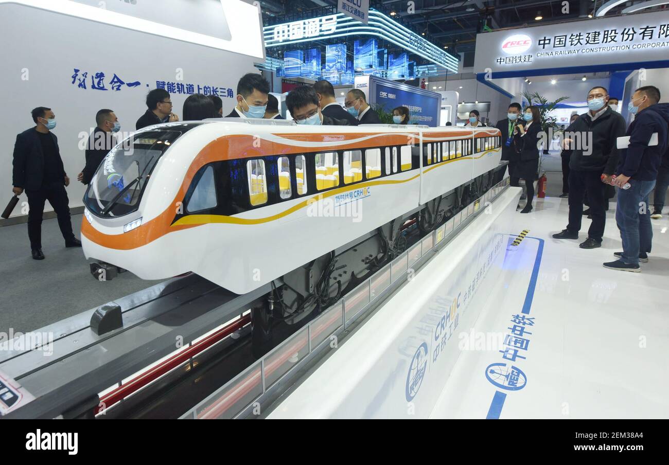 HANGZHOU, CHINA - DECEMBER 4, 2020 - Visitors look at a model of the ...