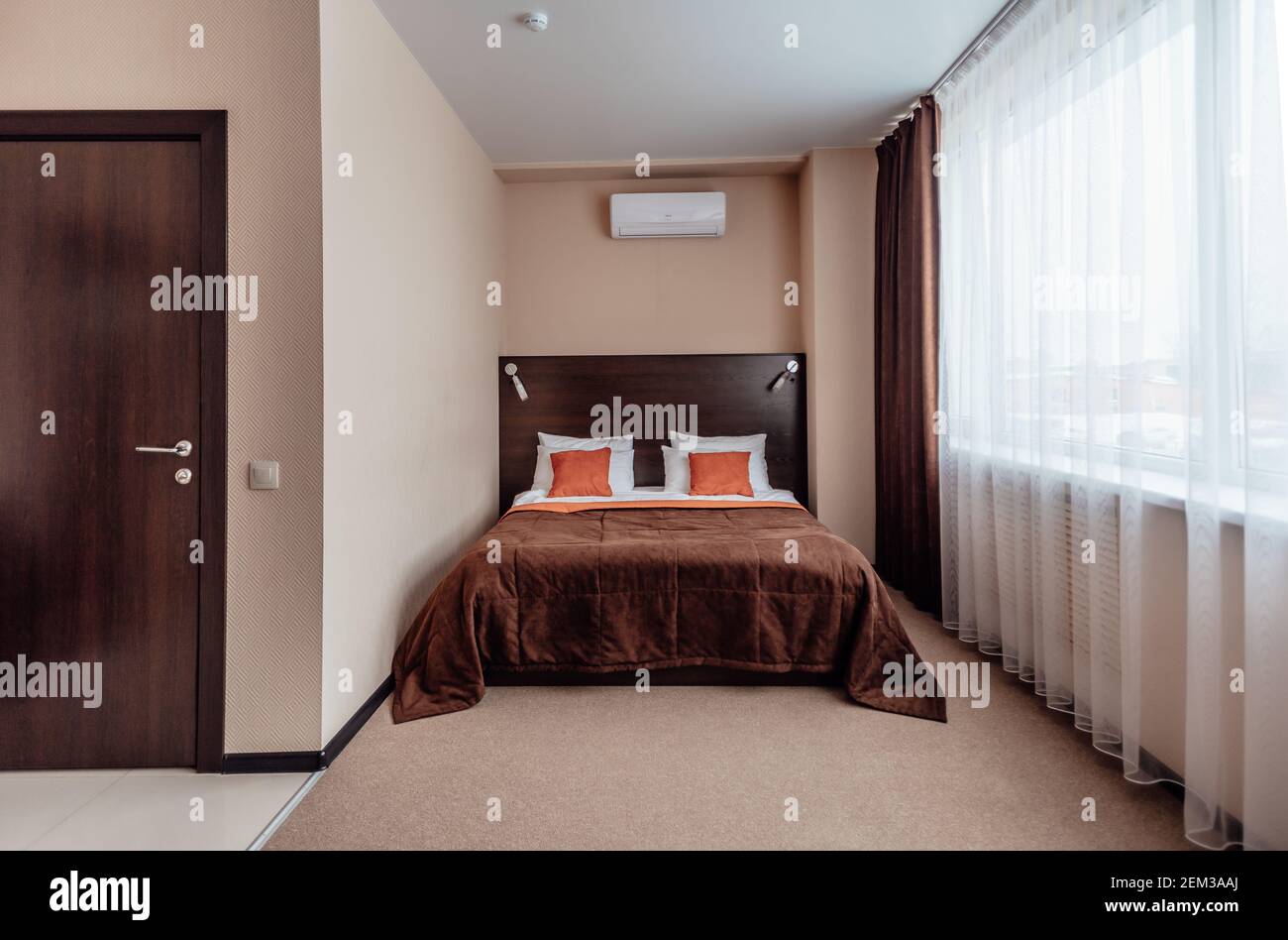 Interior of a comfortable hotel bedroom in the morning in luxury style ...