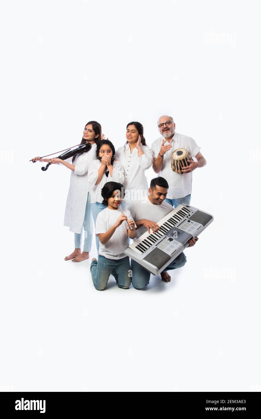 Concert of Indian family of six playing music instruments in a group ...
