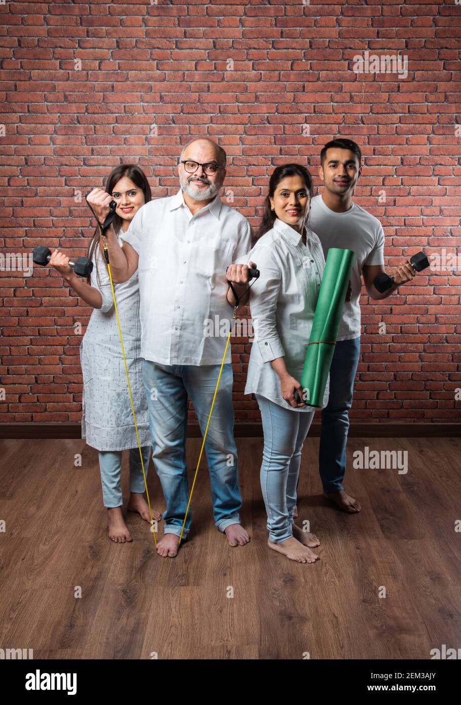 Indian asian Family exercising at home. senior Parents with young kids ...