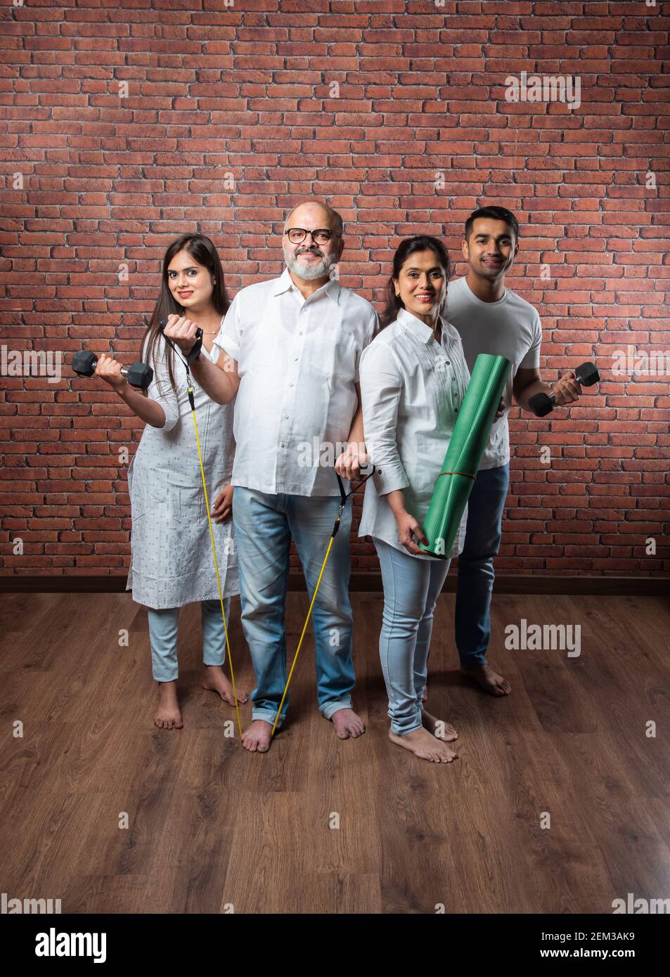 Indian asian Family exercising at home. senior Parents with young kids ...