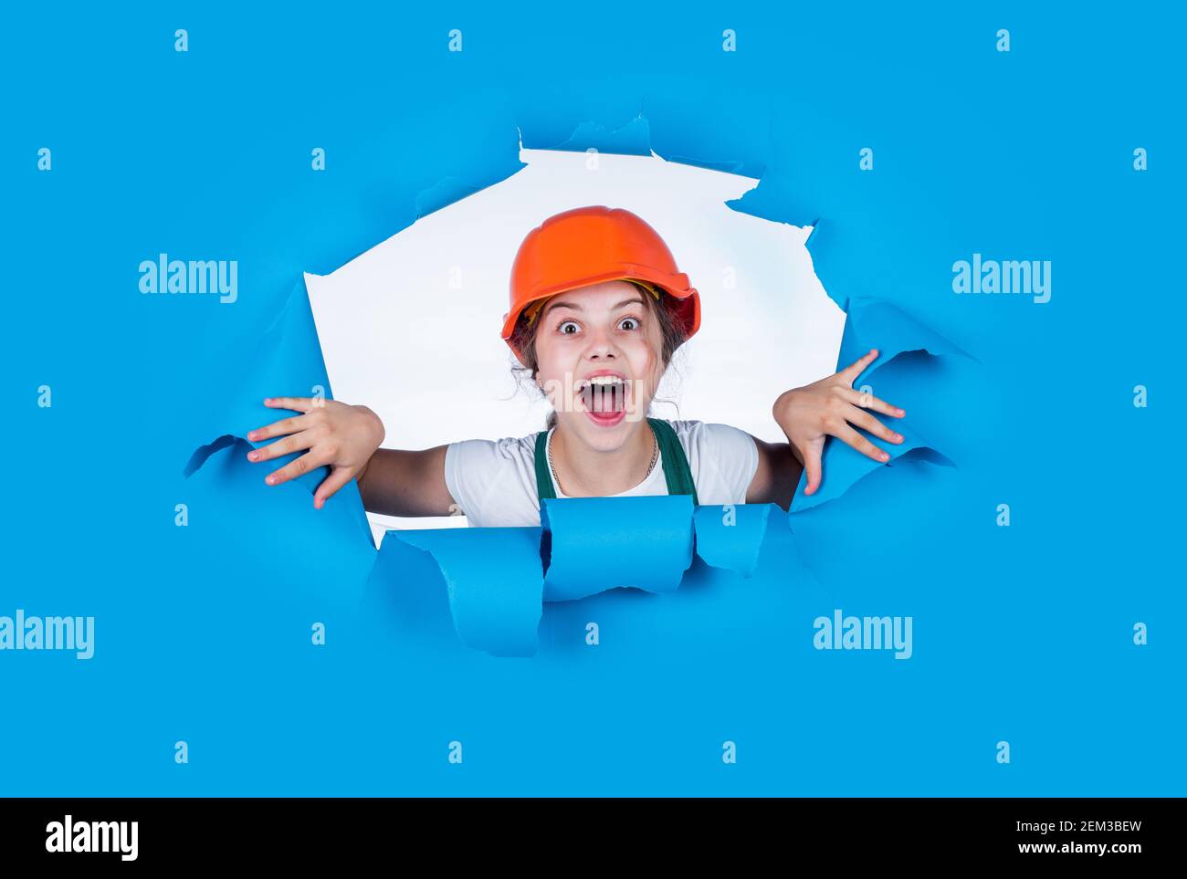 I think I can fix it. kid wear helmet on construction site. teen girl ...