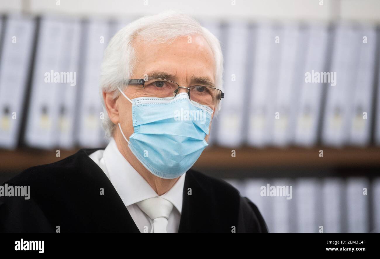 Celle, Germany. 24th Feb, 2021. Presiding judge Frank Rosenow stands in ...