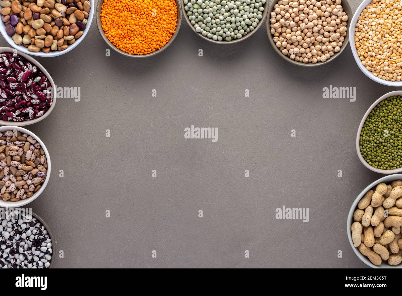 Different types of legumes in bowls, green and yellow peas, chickpeas ...