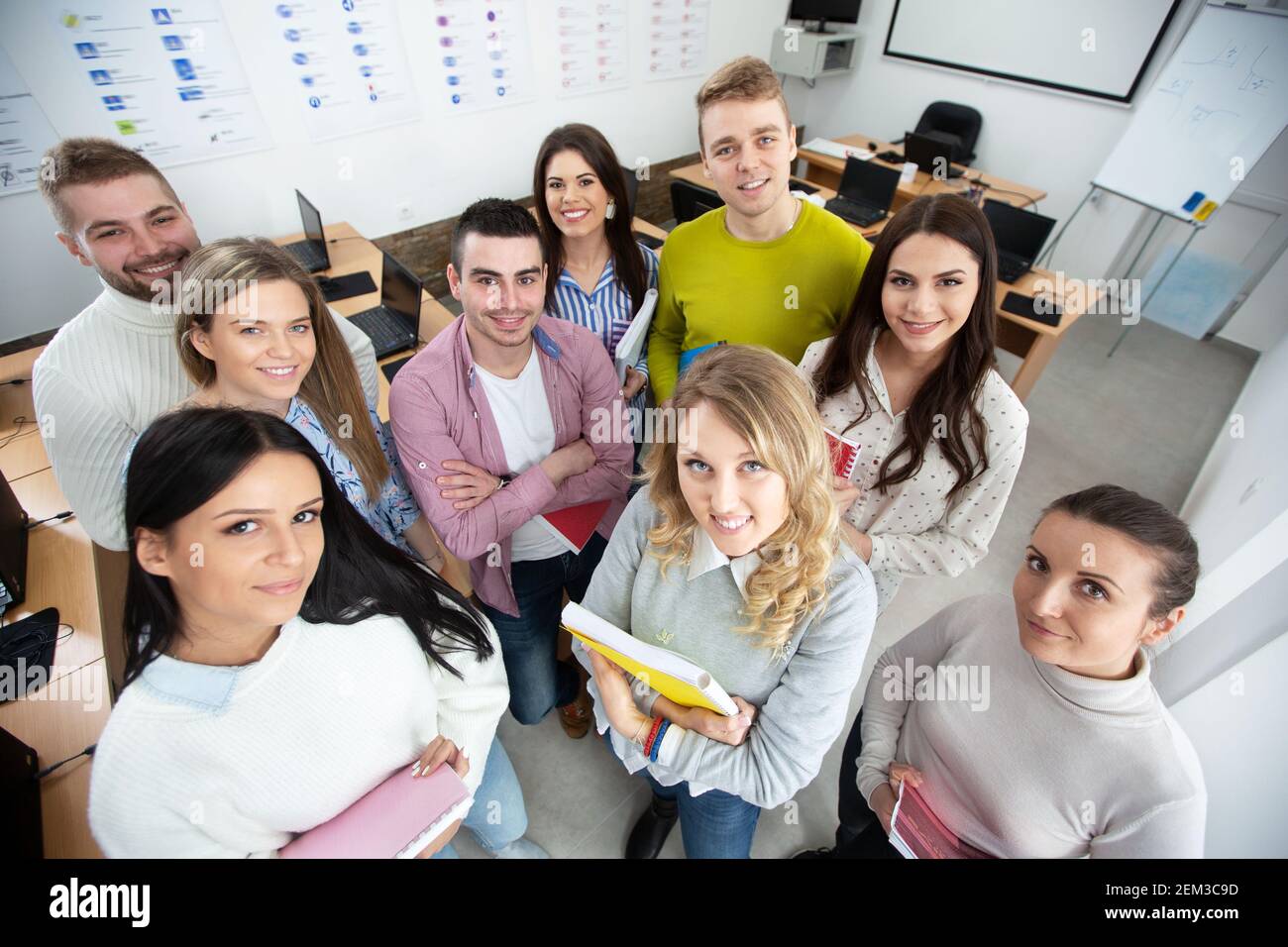 Group of exchange students posing for a pic in their classroom Stock ...