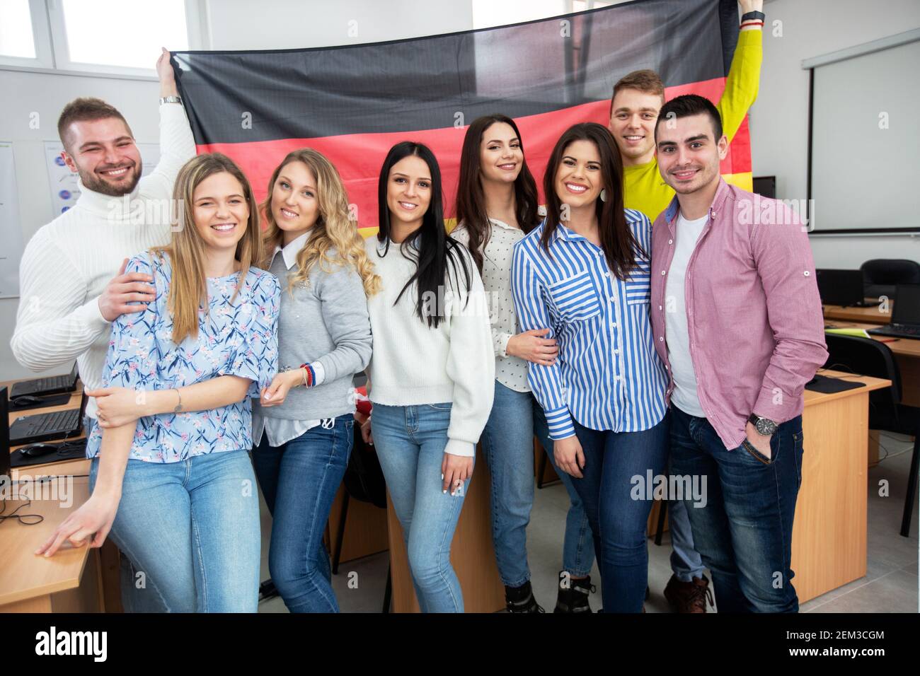 Students taking a picture with German flag in the classroom Stock Photo ...