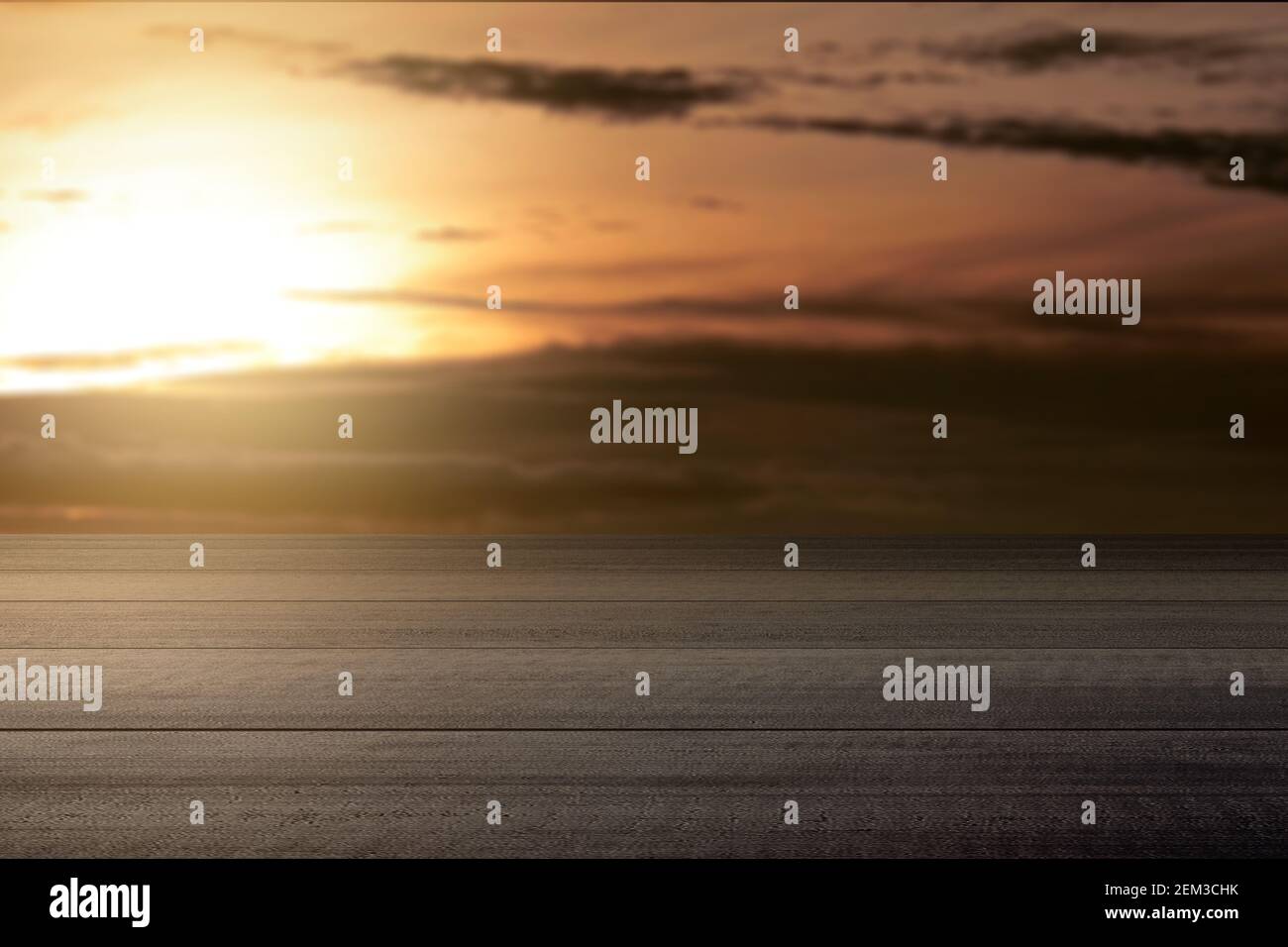Wooden table with a sunset sky background Stock Photo - Alamy