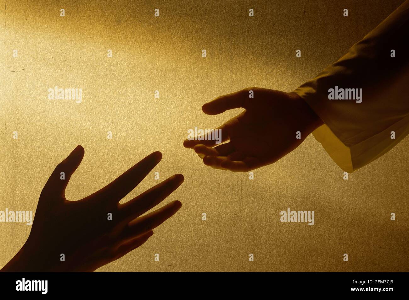 Jesus Christ giving a helping hand to human with wall background Stock ...