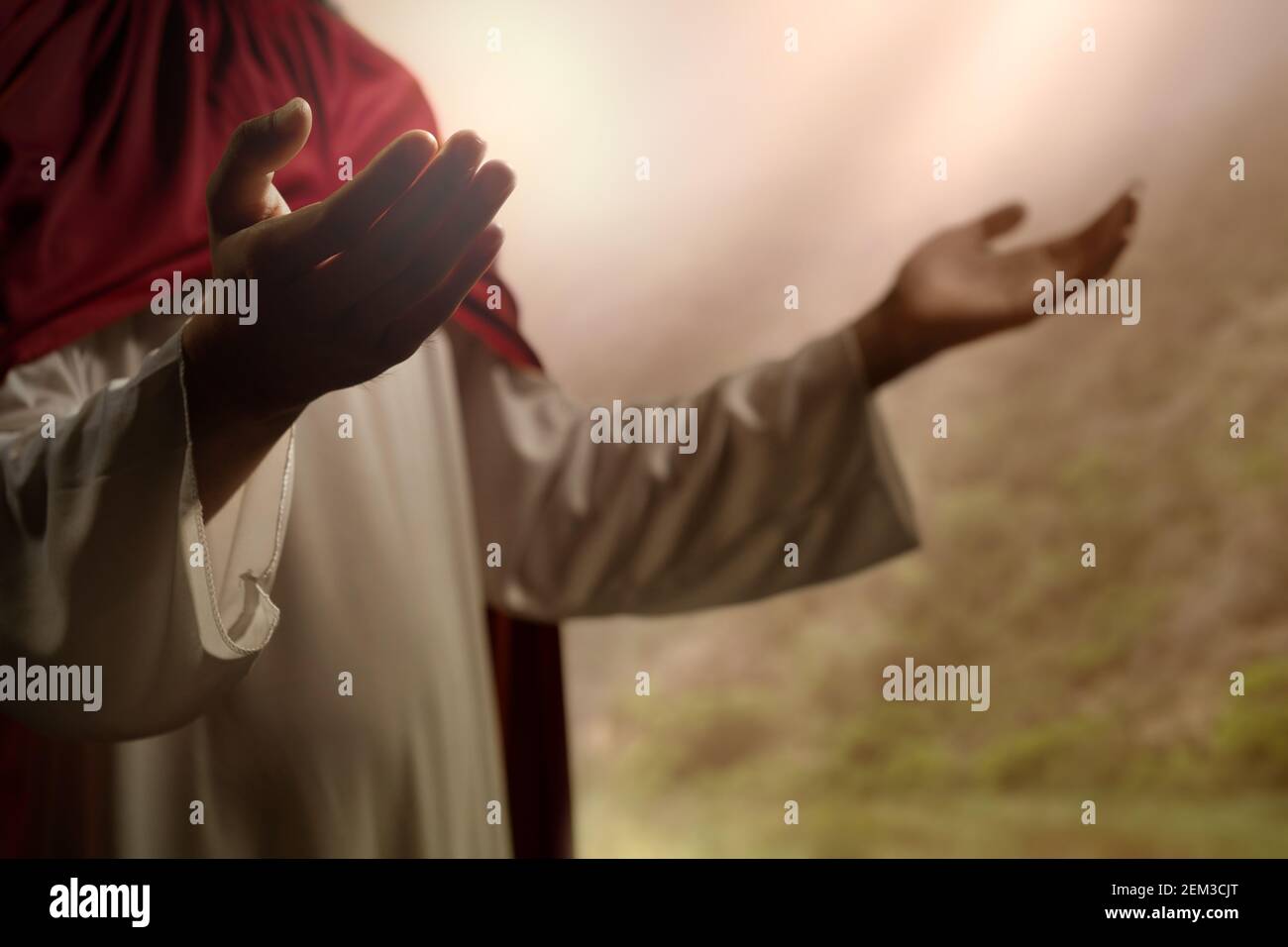 Jesus Christ praying to god with sunlight background Stock Photo - Alamy