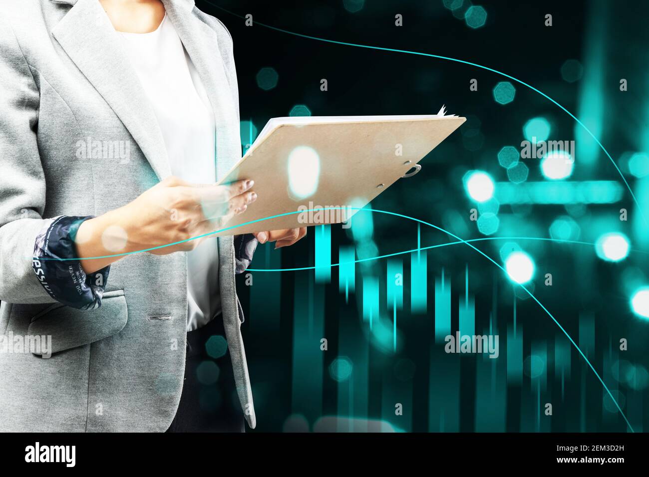 Businesswoman with clipboard showing a virtual bar chart with digital ...