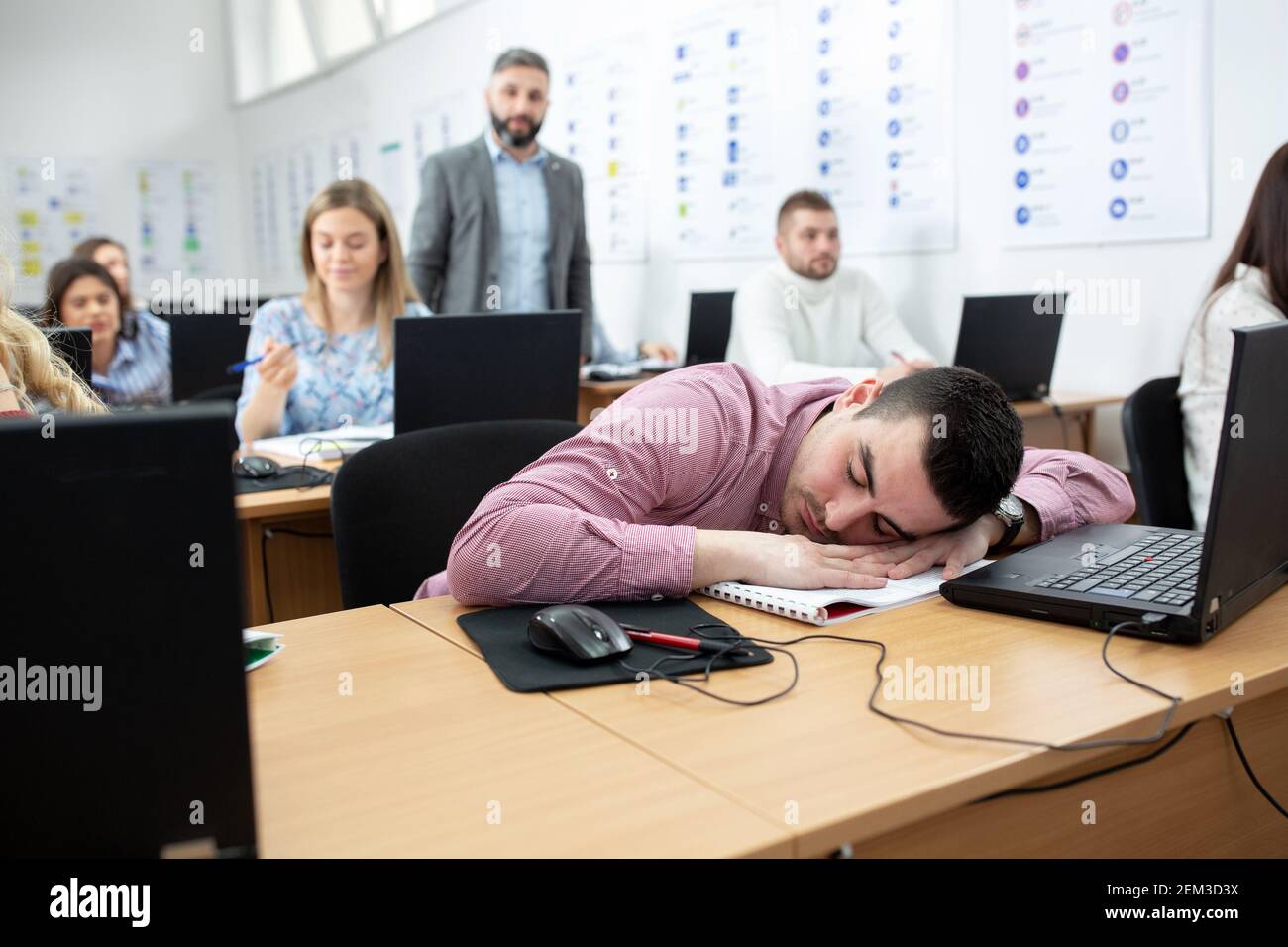 Tired student sleeping in the middle of a class, student concept Stock ...