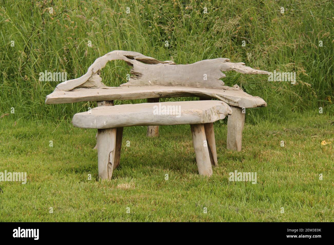 A Rustic Wooden Outdoor Bench and Small Table Stock Photo - Alamy