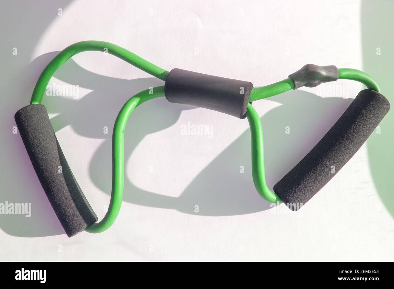 Back in action Modern rubber chest expander on white background Stock ...