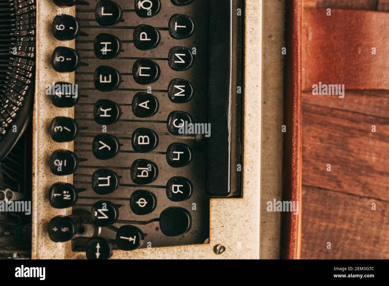 retro typewriter on wooden background and paper decoration texture ...