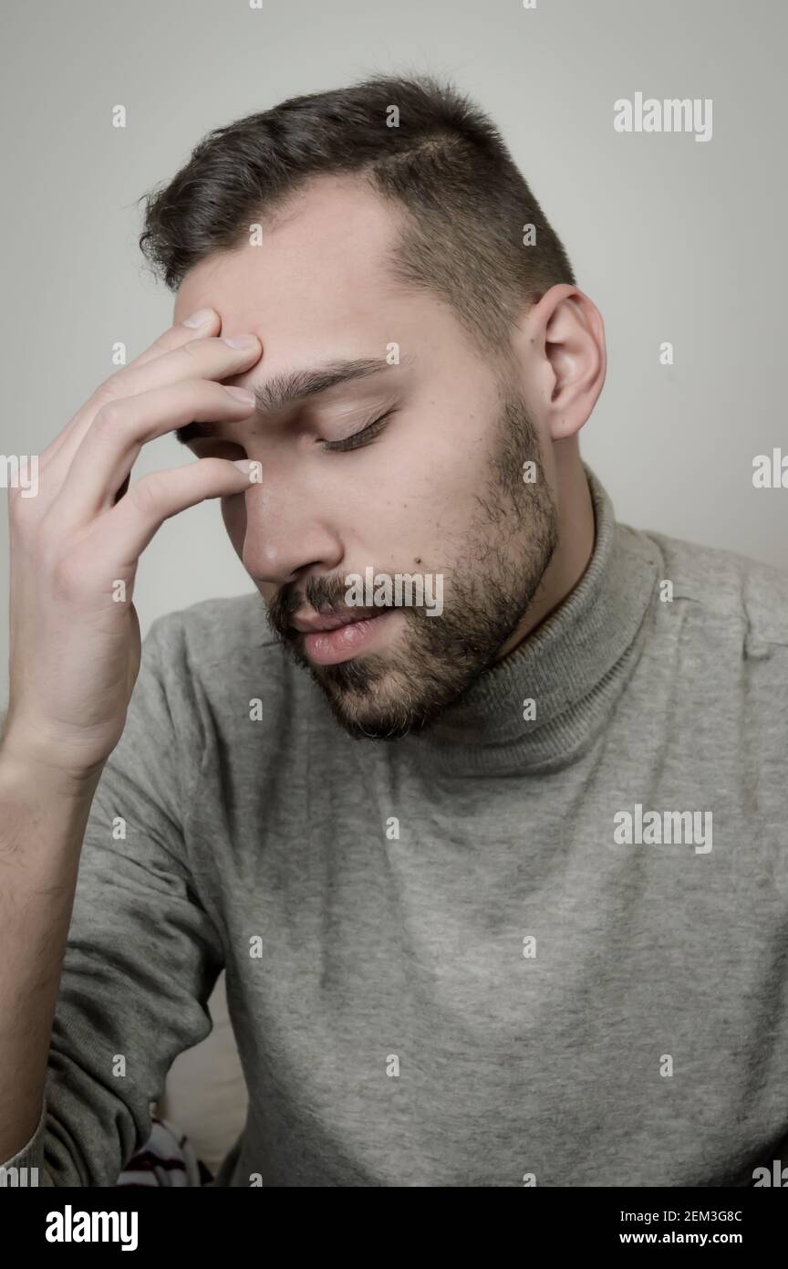 Man touching forehead hand hi-res stock photography and images - Alamy