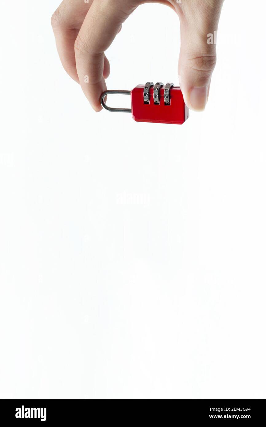 Hand holding padlock hi-res stock photography and images - Alamy