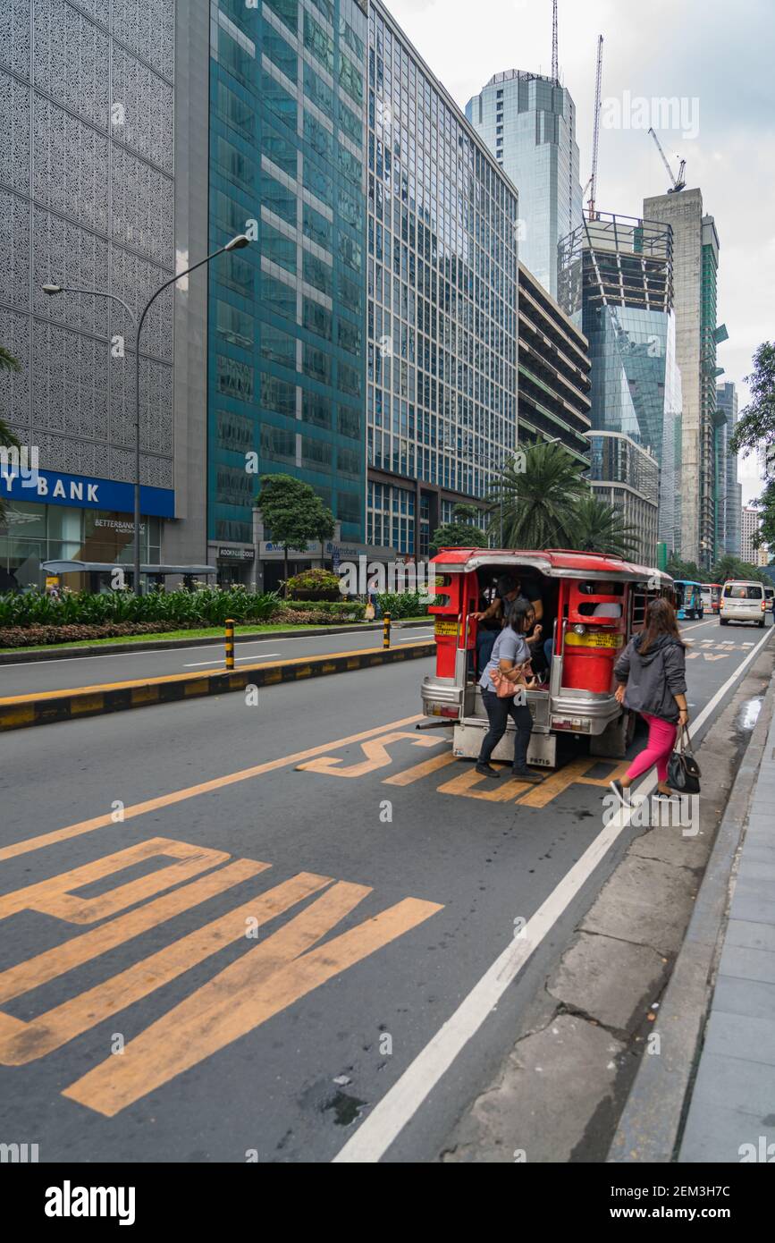 Makati, Metro Manila, Philippines - August 2018: people get off jeepney ...
