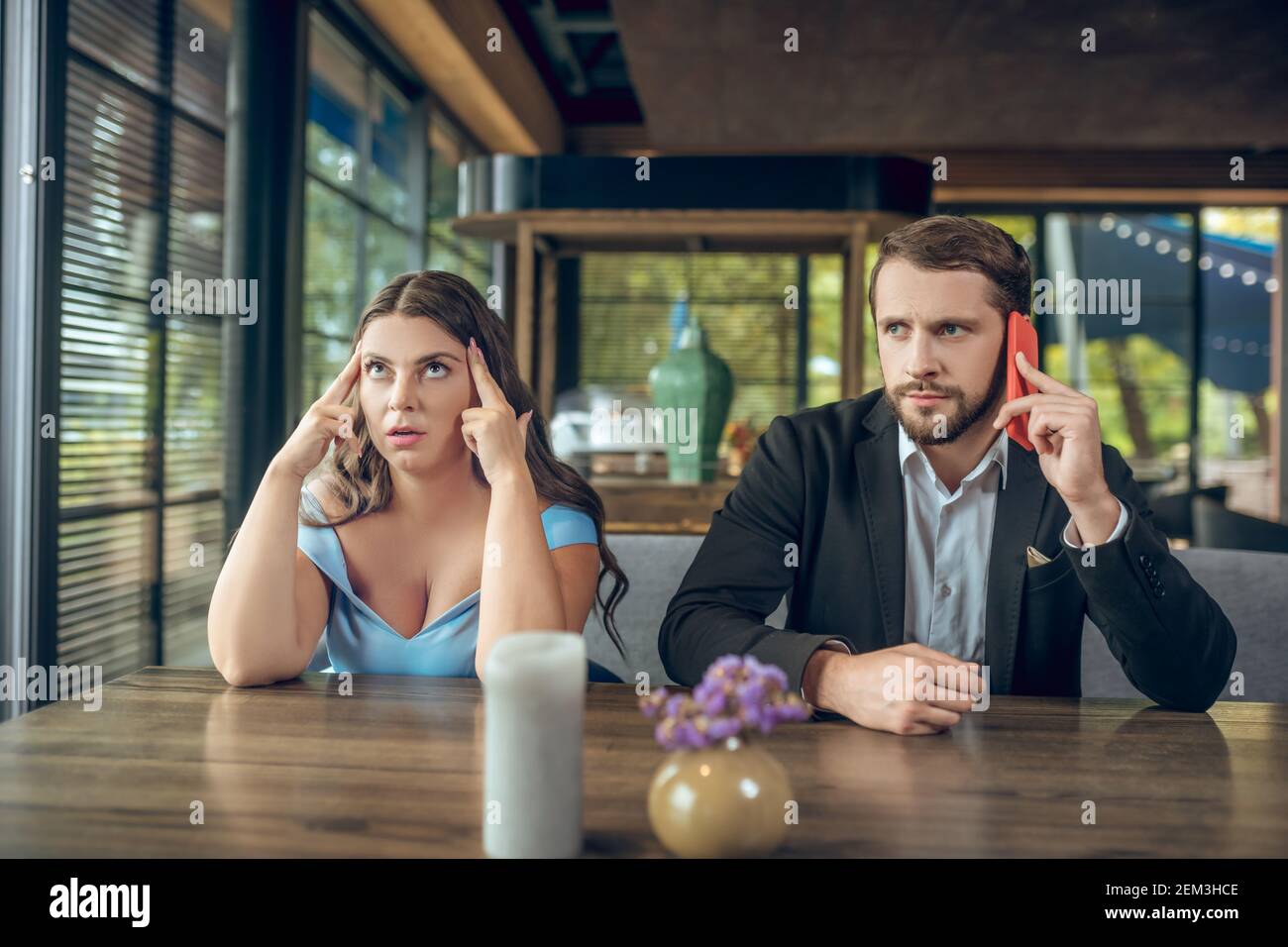 Woman talking inattentive man hi-res stock photography and images - Alamy