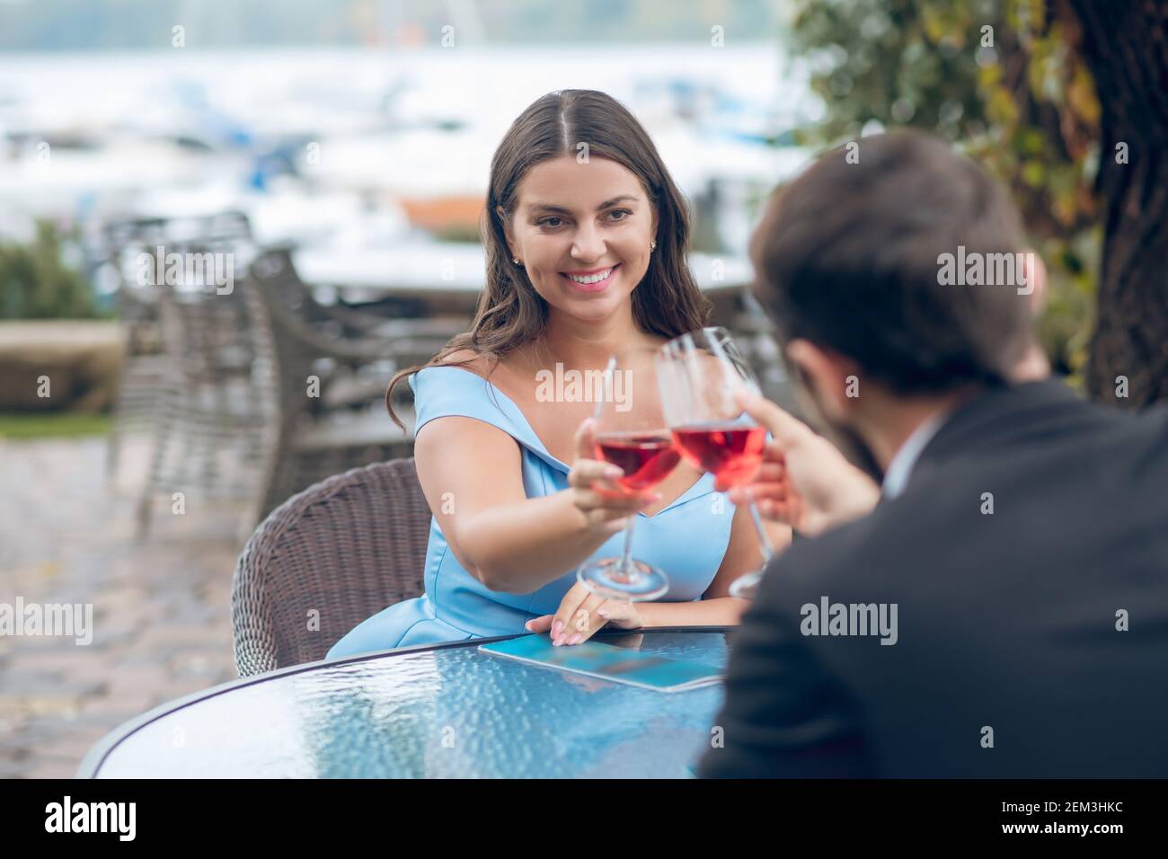 Beautiful woman and man at table in outdoor cafe Stock Photo - Alamy