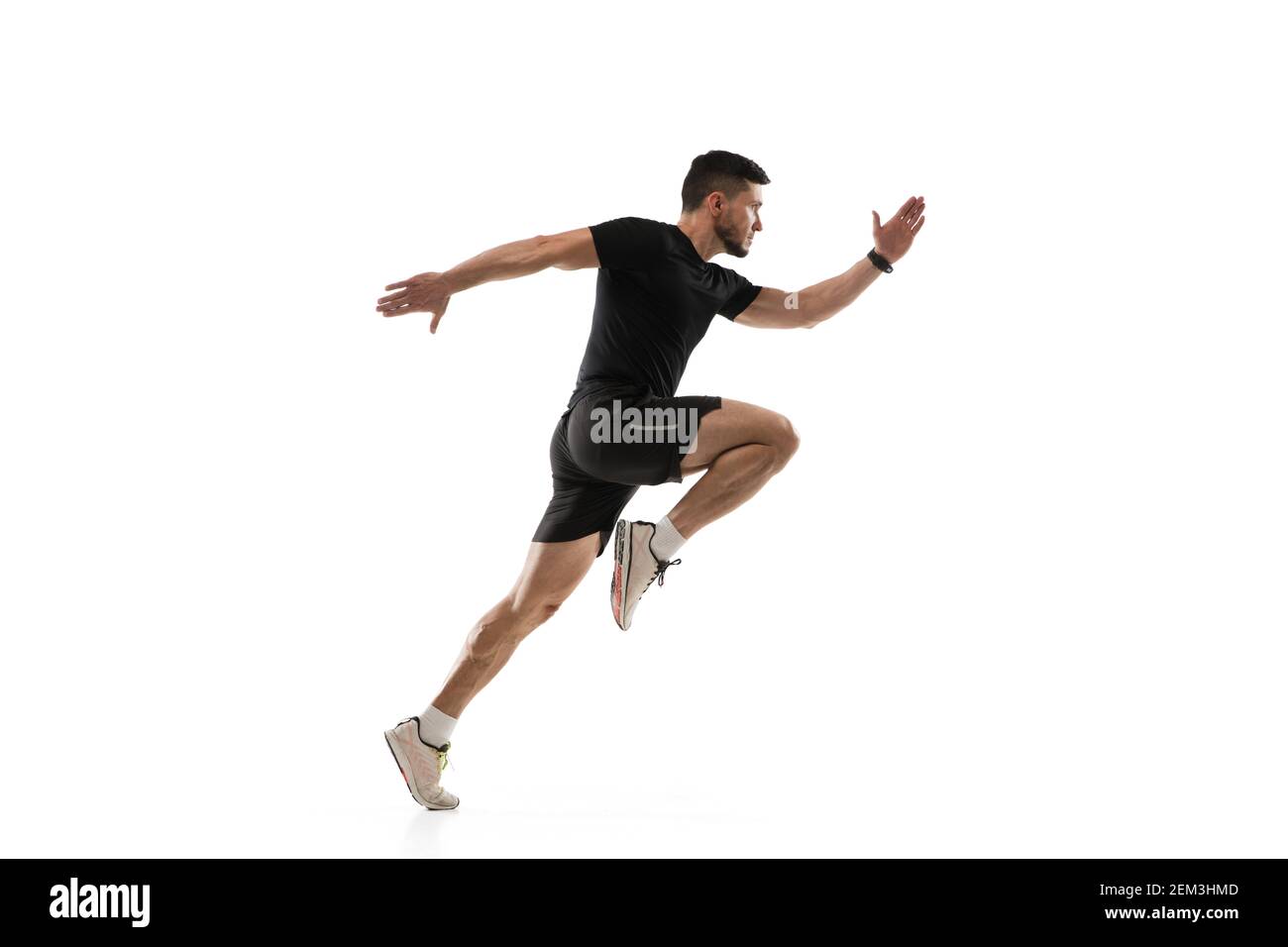 In jump. Caucasian professional sportsman training isolated on white ...