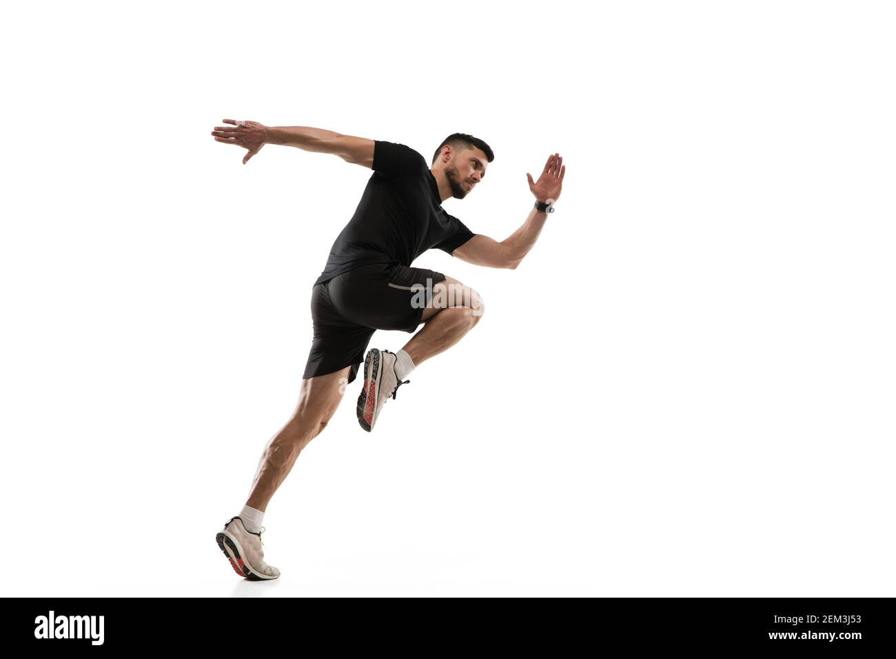 In jump. Caucasian professional sportsman training isolated on white ...