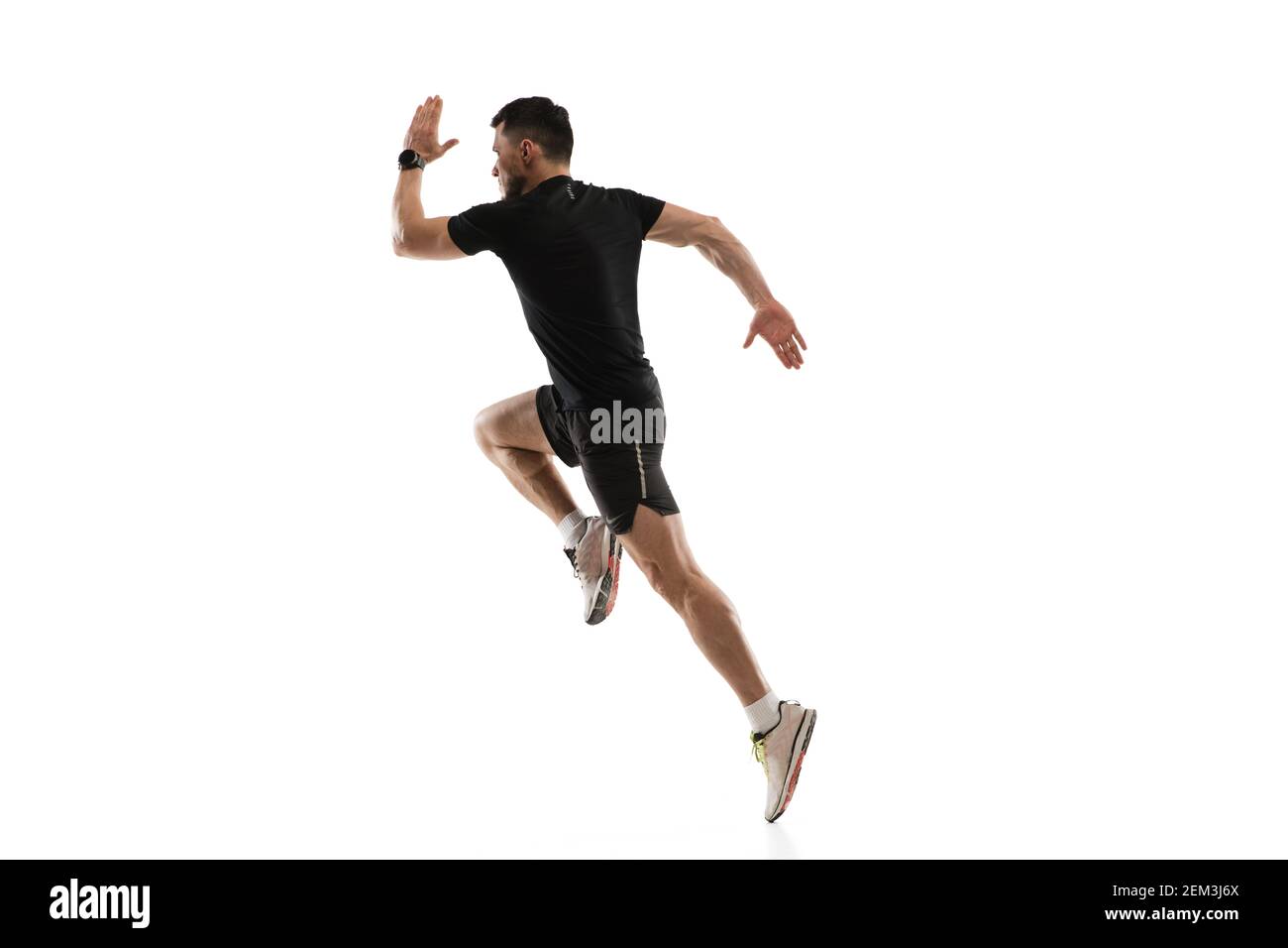 In jump. Caucasian professional sportsman training isolated on white ...