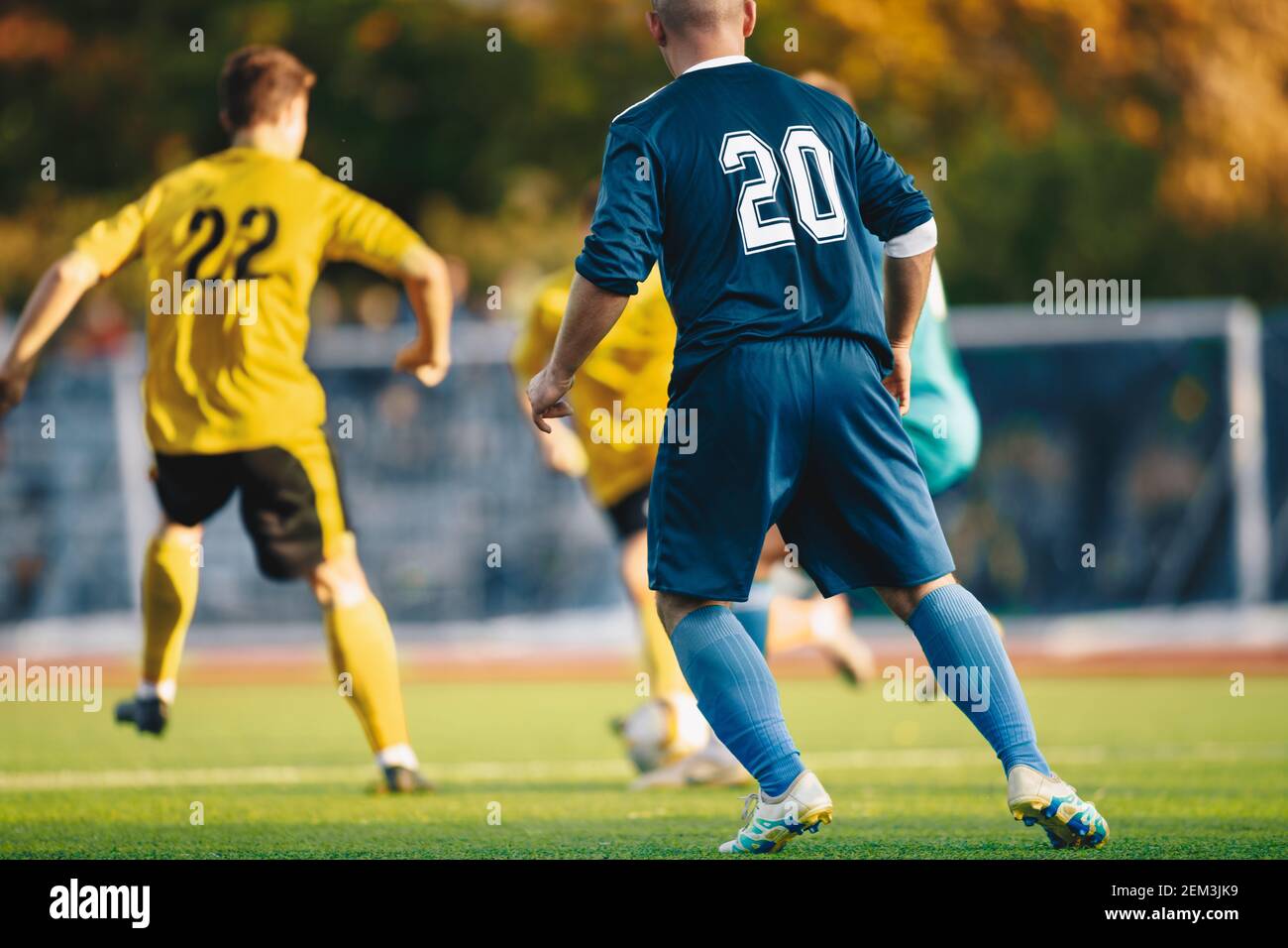 Adult Men Playing European Football Soccer. Footballers Running and ...